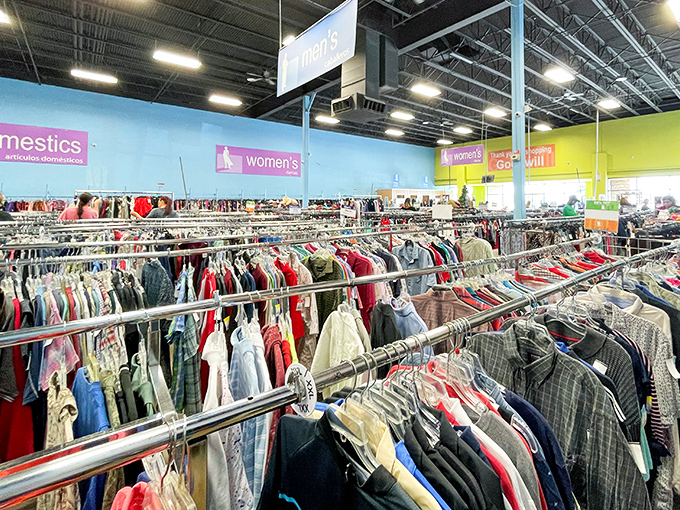 Men's clothing organized with military precision. From business casual to weekend wear, these racks hold second chances for first impressions.