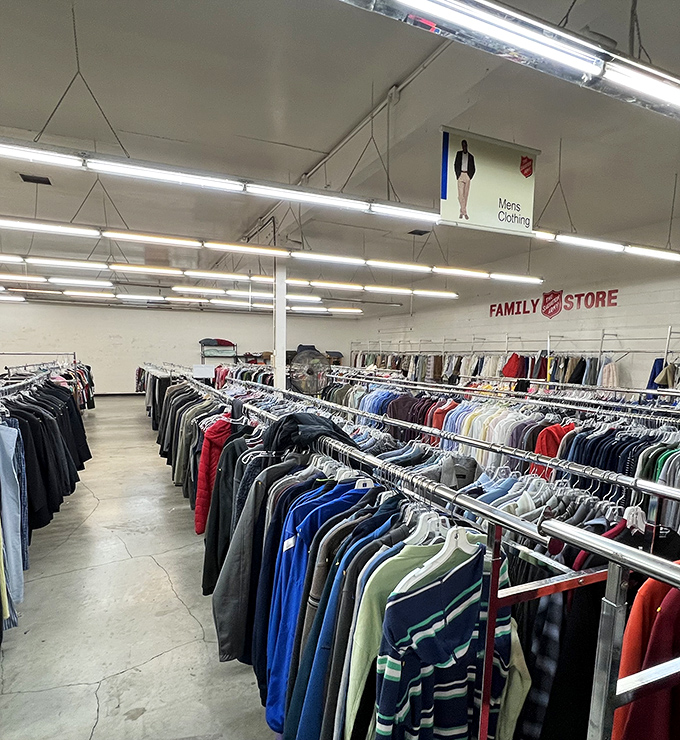 Rows of men's clothing stretch like a rainbow of second chances waiting for new adventures.