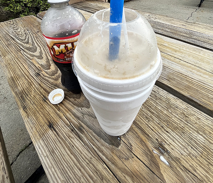 The milkshake that launched a thousand road trips, paired with its root beer companion. Thick enough to require serious straw commitment.