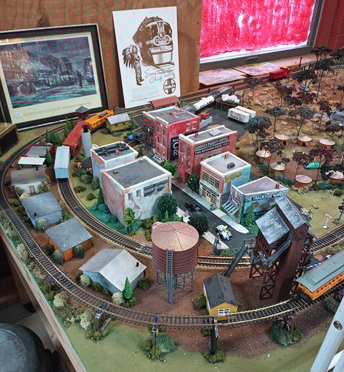 This miniature train town diorama would make any model railroad enthusiast weak in the knees. Tiny buildings, tiny trees, enormous charm.