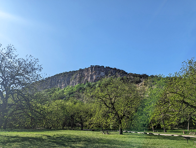 Old Baldy stands like a limestone sentinel, daring visitors to climb for views that make your smartphone camera seem woefully inadequate.