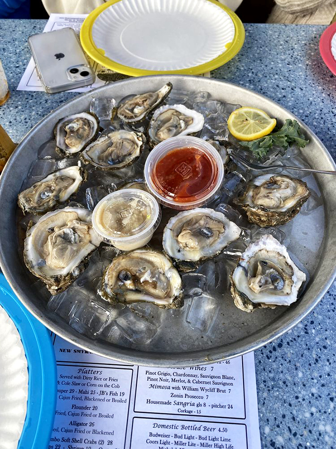 These oysters aren't just served; they're presented like the treasures they are &ndash; glistening on ice, waiting for just a squeeze of lemon to reach perfection.