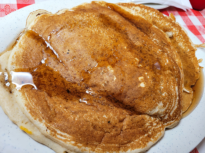Pancakes so golden they belong in Fort Knox. These fluffy discs of joy are what breakfast dreams are made of &ndash; no alarm clock required.