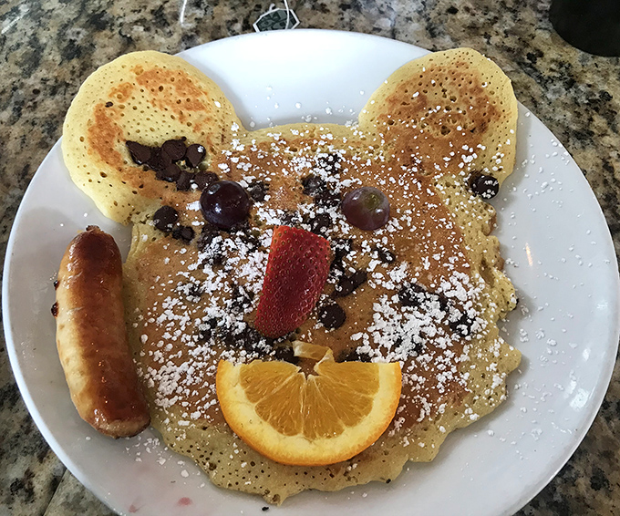 A pancake with personality! This bear-shaped delight comes complete with fruit features and a sausage sidekick. Breakfast with a smile.
