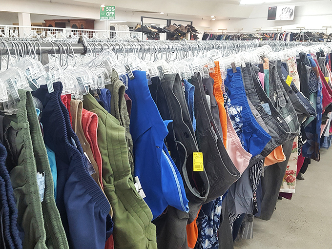 The pants section offers a denim democracy—where designer labels and humble basics hang side by side in perfect thrifting harmony.
