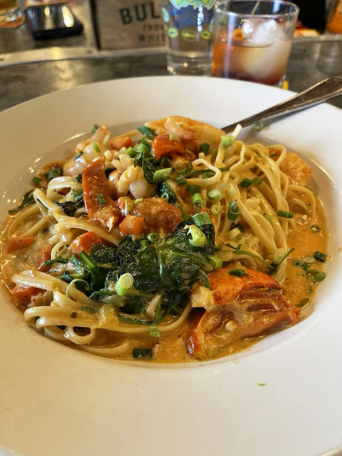 Seafood pasta that's having an identity crisis&mdash;is it comfort food or gourmet cuisine? With plump shrimp and fresh greens swimming in that sauce, who cares about labels?