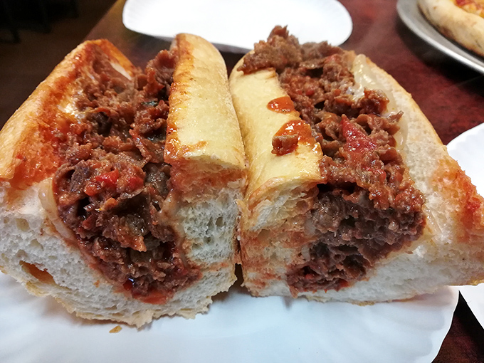 The legendary pizza steak in all its saucy, meaty glory. Philadelphia's culinary marriage counselor, uniting two beloved foods forever.