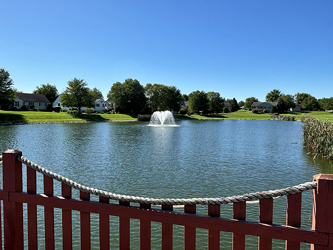 The community pond&mdash;nature's mood stabilizer. That fountain isn't just pretty; it's drowning out any thoughts you might have about mowing your own lawn ever again. 