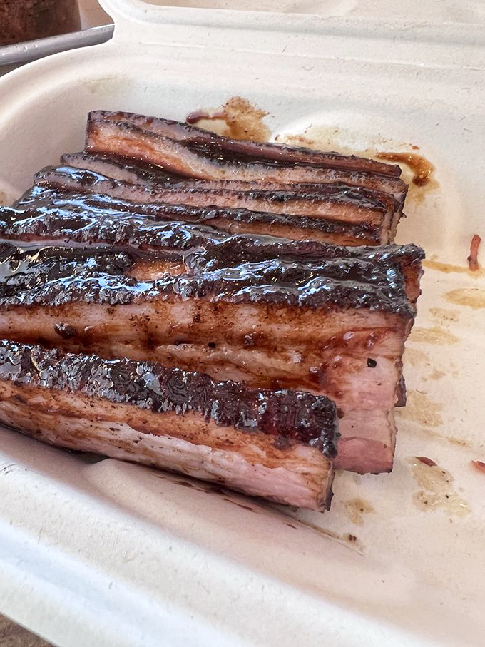 Pork belly that glistens with promise. Each layer tells a different story&mdash;crispy, fatty, meaty&mdash;a trilogy of pure satisfaction.