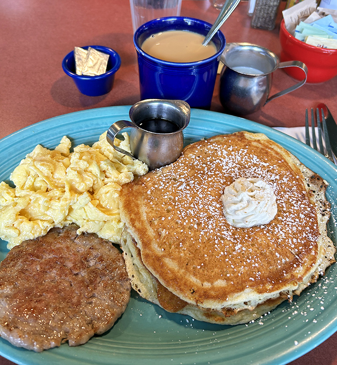 Golden pancakes with a dollop of butter, perfectly scrambled eggs, and a sausage patty&mdash;the breakfast equivalent of hitting the lottery.