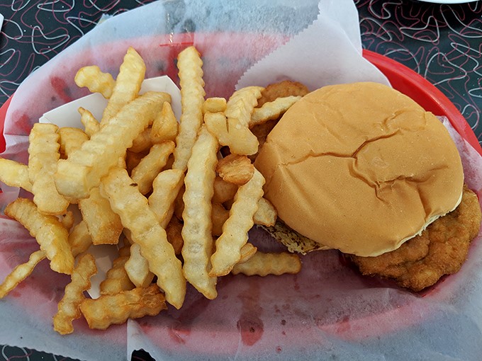 The pork tenderloin sandwich with crinkle-cut fries&mdash;where the meat extends well beyond the bun's jurisdiction, as nature intended.