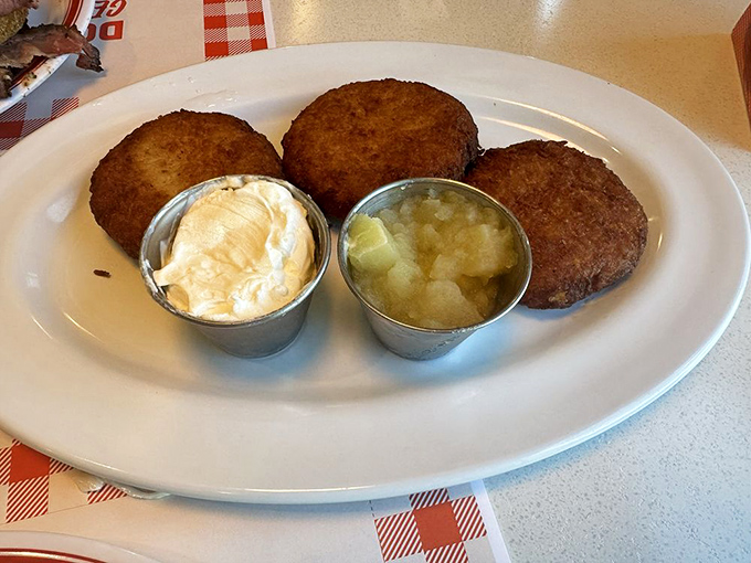 Those golden potato pancakes arrive crispy and proud, with sour cream and applesauce standing by like loyal companions.