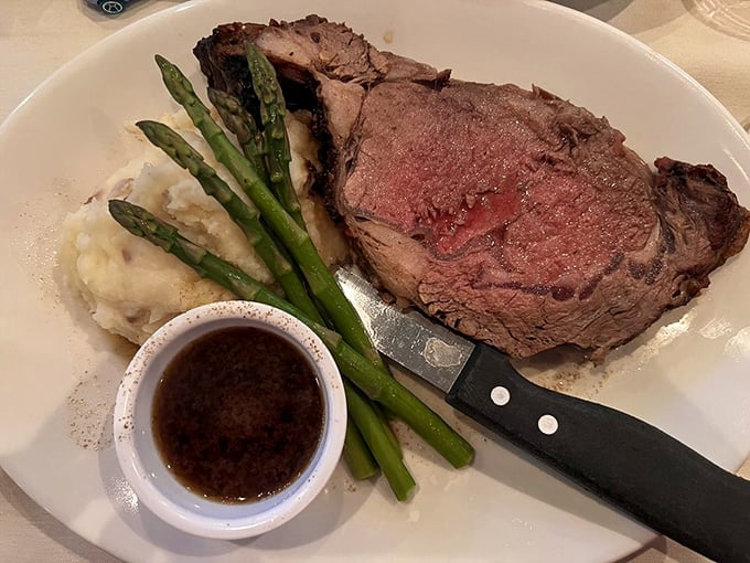 Behold the prime rib in all its glory&mdash;a carnivore's dream with that telltale pink center, served with au jus that's practically liquid gold.