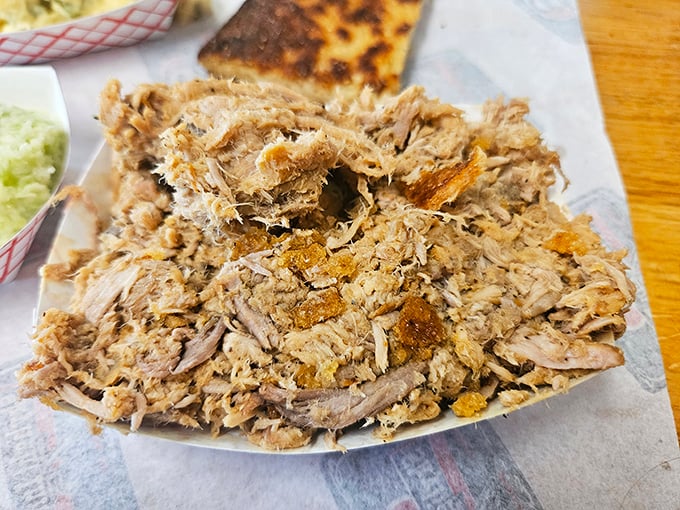 This isn't just pulled pork&mdash;it's Eastern Carolina poetry on a plate, each strand telling a story of smoke, time, and tradition.