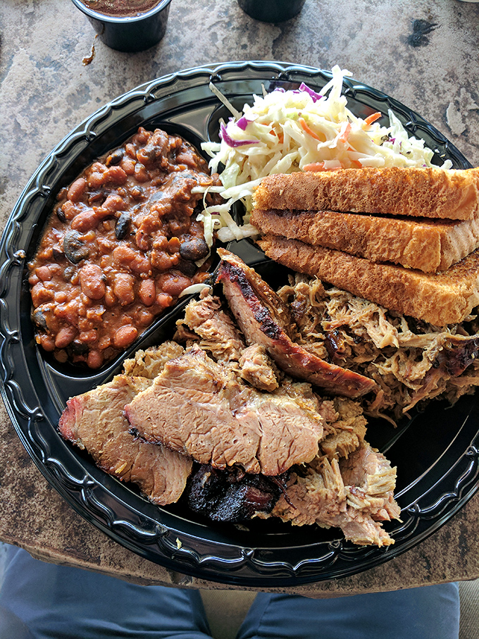 BBQ's greatest hits on one plate: pulled pork, brisket, and beans. Like a meat-lover's mixtape, but you can eat it.