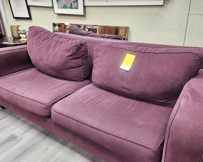 Purple reign! This plush sofa isn't just furniture&mdash;it's a statement piece that would make Prince nod in approval.