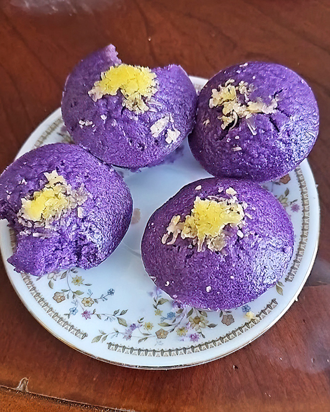 These vibrant purple puto (rice cakes) aren't just dessert, they're edible art &ndash; like little purple planets dusted with cheese that landed on your plate. 