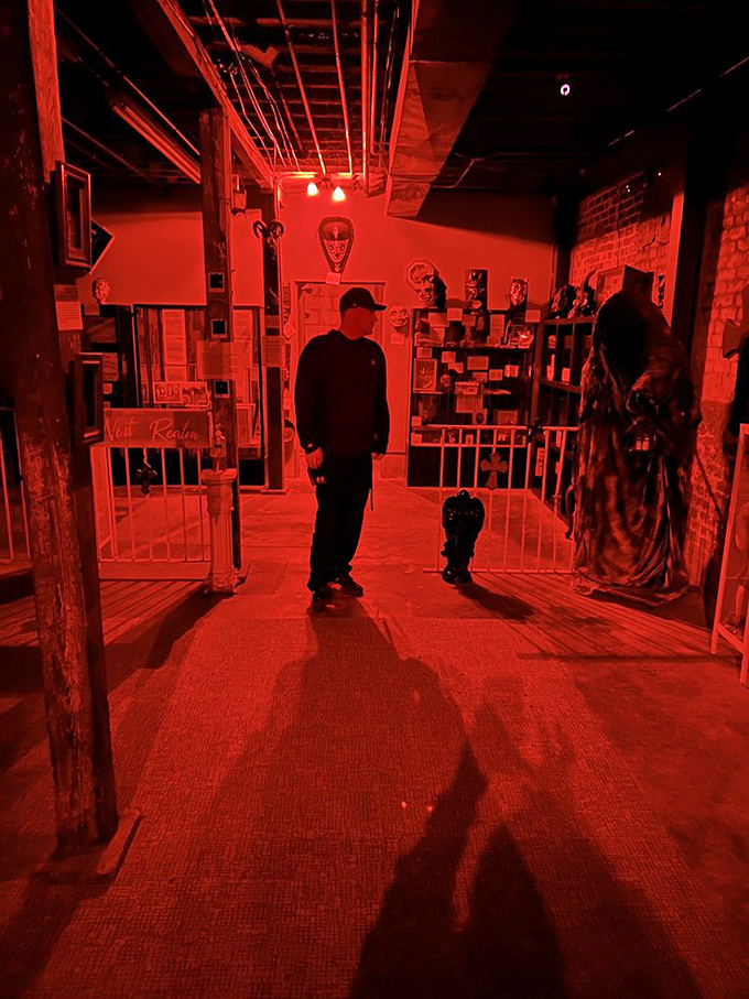 The crimson glow bathes everything in an otherworldly light, making even the most skeptical visitor wonder what lurks in the shadows.