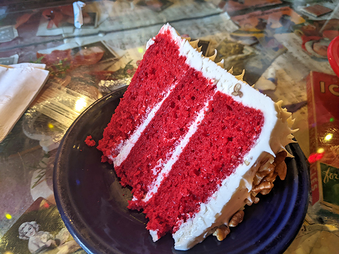 Red Velvet Cake so vibrant it could stop traffic, with layers of cream cheese frosting thick enough to get lost in.