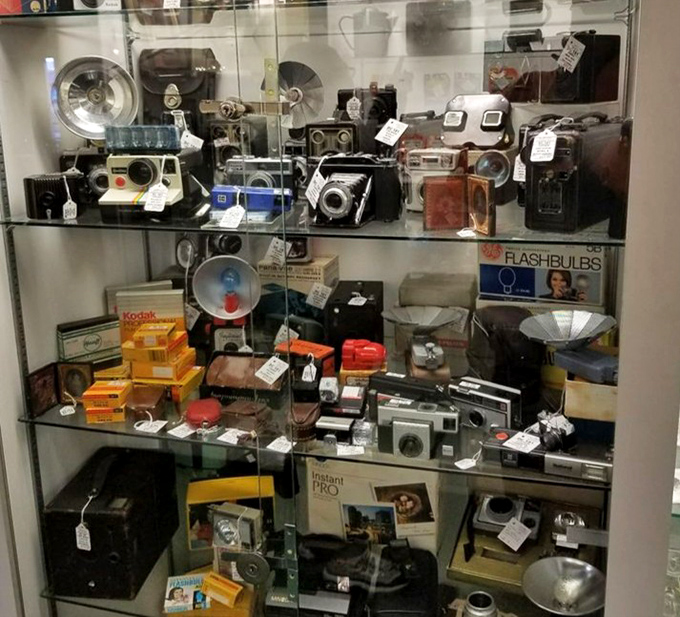 From Polaroids to flashbulbs, this cabinet holds the ancestors of your smartphone's camera in all their mechanical glory.