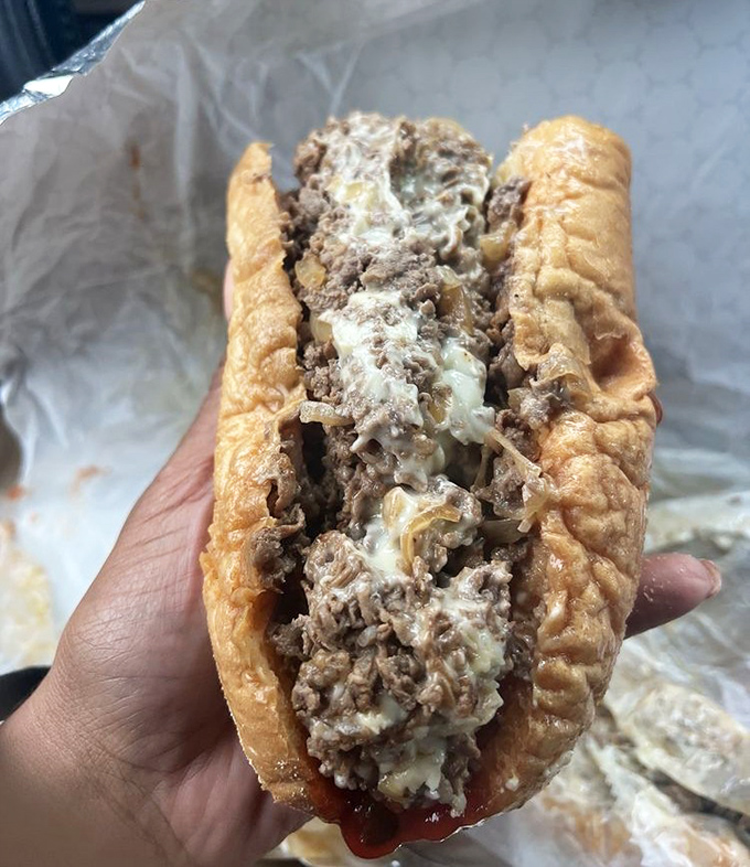 The money shot: ribbons of tender ribeye intertwined with perfectly melted cheese. Some people frame art; I'd rather eat it.