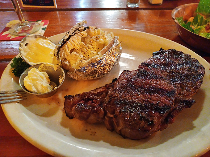 This isn't just a steak&mdash;it's a statement. A perfectly cooked ribeye with a baked potato that's dressed for the occasion.