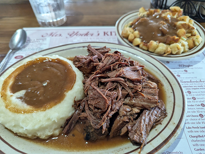 Pot roast so tender it surrenders at the mere sight of your fork, paired with mashed potatoes that could solve world peace.