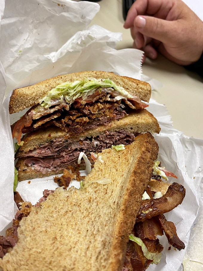 This isn't just a roast beef sandwich; it's a masterclass in texture. Crispy bacon, tender beef, and fresh veggies create a symphony in every bite.