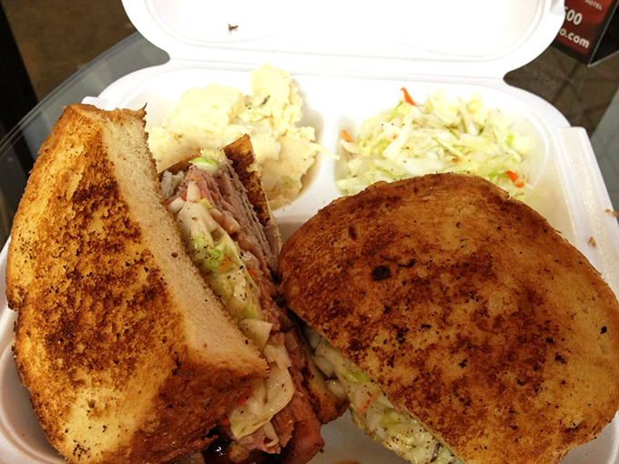 Not just a sandwich but an architectural marvel of toasted bread, creamy slaw, and that heavenly pulled pork.