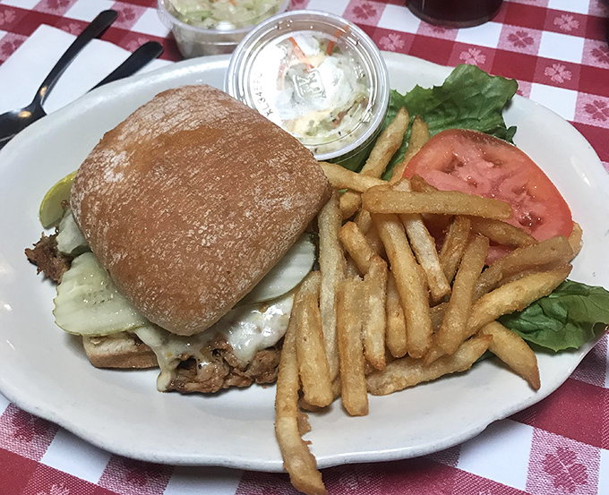 A sandwich that requires both hands and a strategy. This isn't fast food; it's slow food worth savoring&mdash;the perfect midday fuel for Dells adventures.