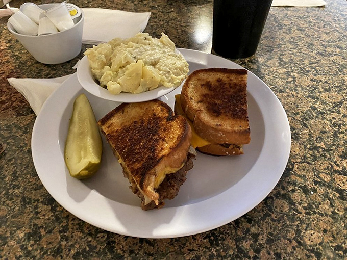 A proper diner patty melt&mdash;where buttery grilled bread meets melted cheese and beef in a harmonious union that transcends fast food.