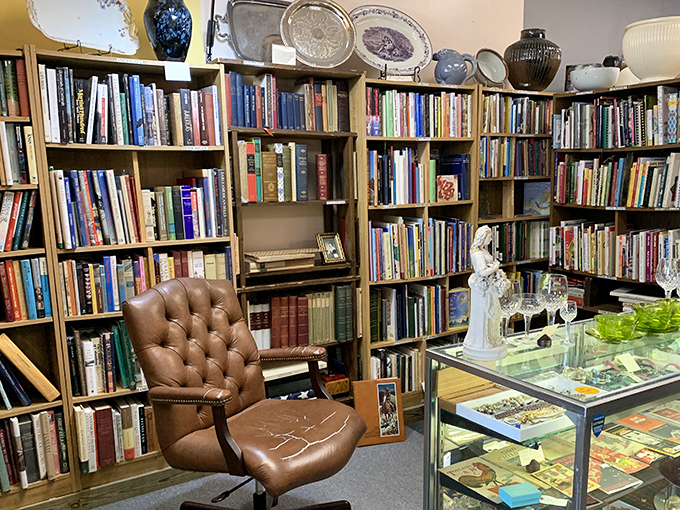 A bibliophile's dream corner complete with leather chair&mdash;because time disappears when surrounded by stories waiting to be rediscovered.