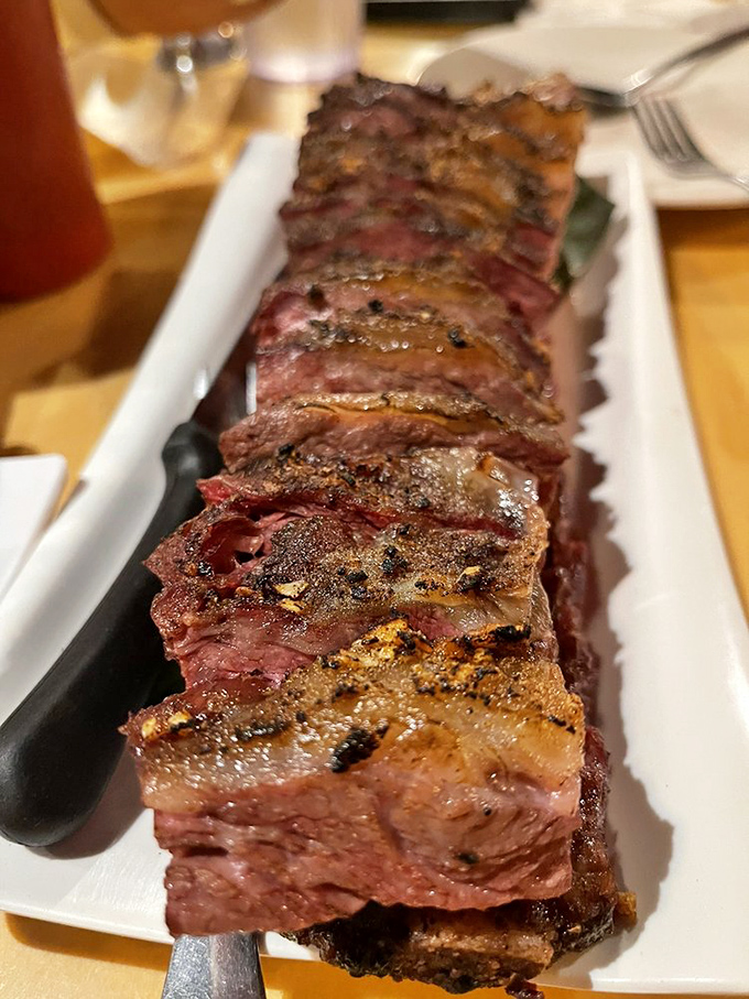 These short ribs boast the perfect pink smoke ring barbecue aficionados dream about, sliced thin yet bursting with flavor in every bite.