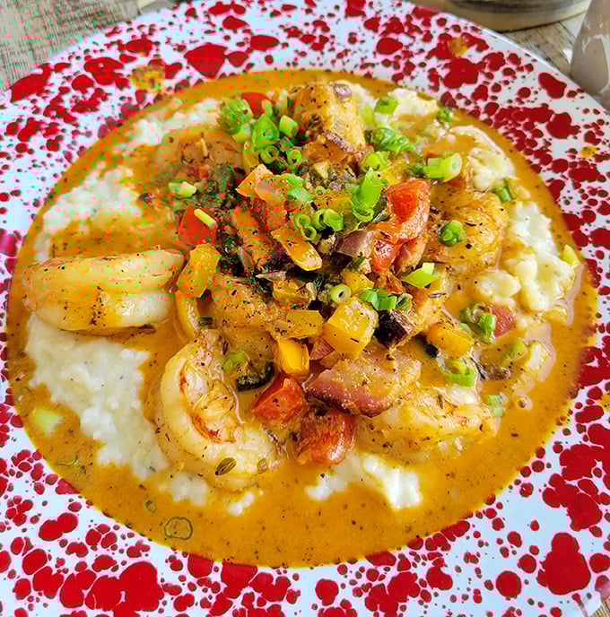 Shrimp and grits that would make a Southerner weep with joy, served on those signature speckled plates that have launched a thousand Instagram posts.