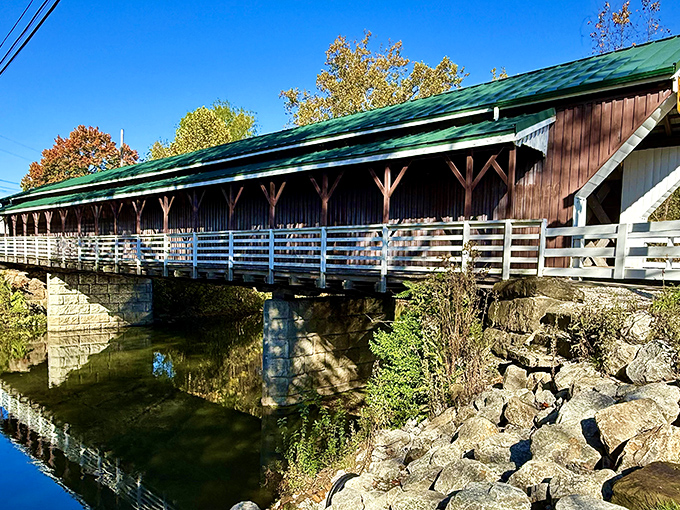 The bridge's reflection in the water below creates a perfect symmetry – nature and human ingenuity having a pleasant conversation across centuries.