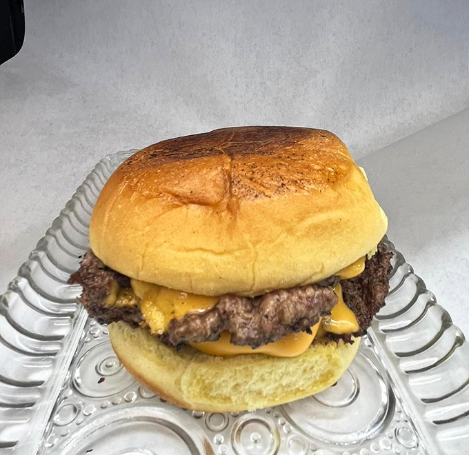 Cheese oozing over the edges of this smash burger creates the kind of food moment you'll reminisce about later.