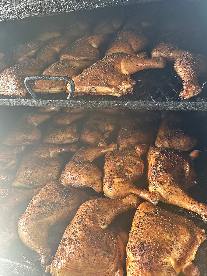 Chicken quarters getting the low-and-slow treatment. Like sunbathers on a Florida beach, except they're actually getting tastier by the minute.