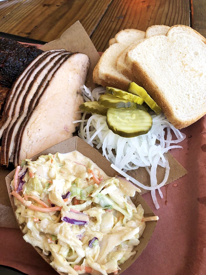 Turkey that defies the "dry poultry" stereotype, sliced thin enough to read through. Paired with tangy slaw, it's Thanksgiving's cooler, more laid-back cousin.