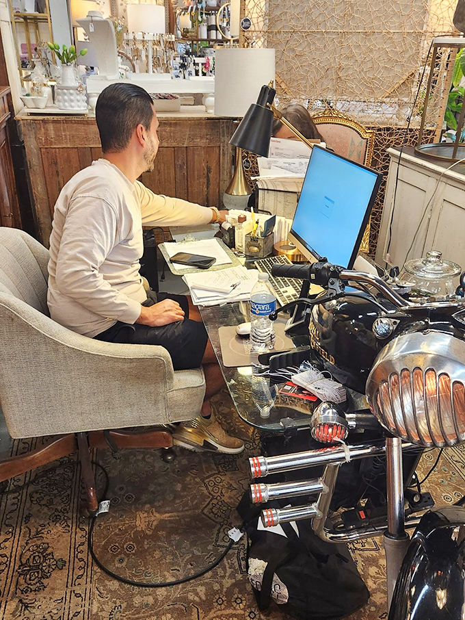Where the magic happens&mdash;a dealer's workspace nestled among treasures. The modern computer looks almost anachronistic amid the vintage splendor.