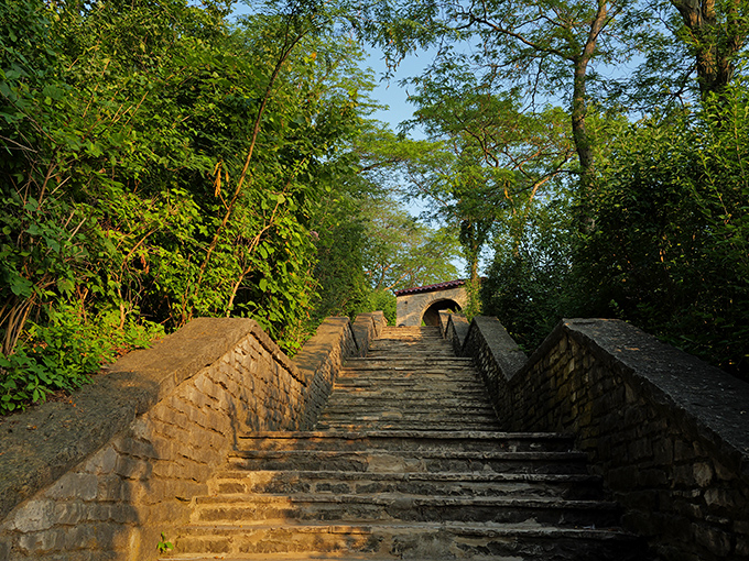 These historic stone steps have carried generations of beach-goers toward summer memories. Each worn edge tells stories of sandy feet and sunscreen-scented journeys to the shore below.