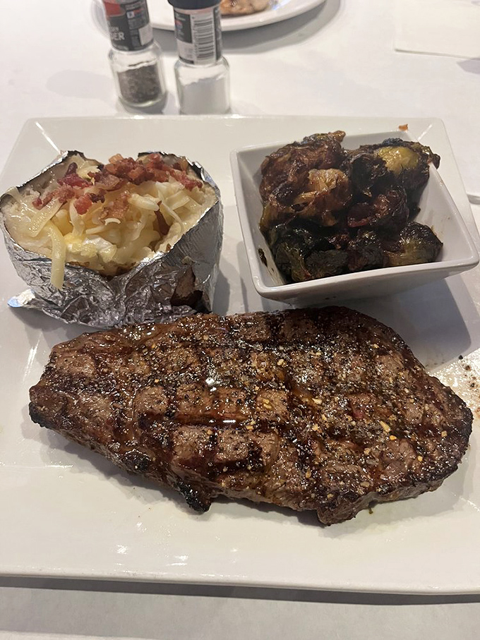 This steak doesn't need a passport to transport you to steakhouse heaven. The loaded potato and Brussels sprouts are worthy travel companions.