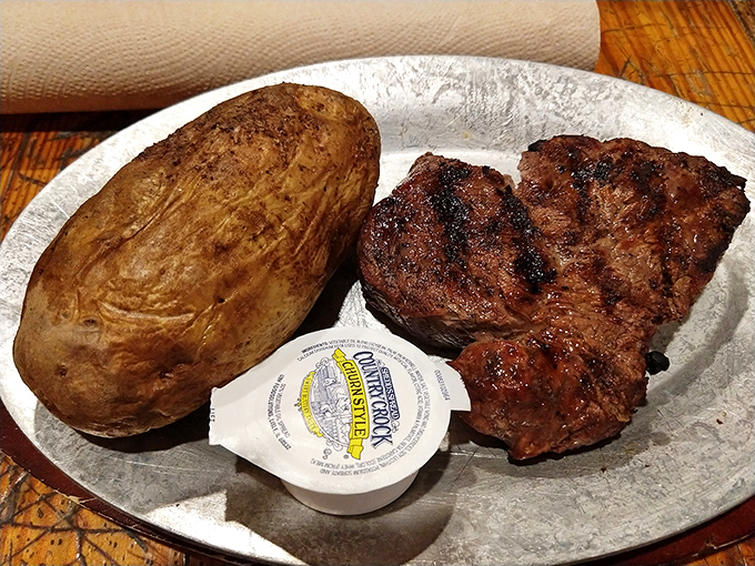 Steak perfection doesn't need fancy presentation &ndash; just a properly seared exterior, pink interior, and a potato that could feed a small family.