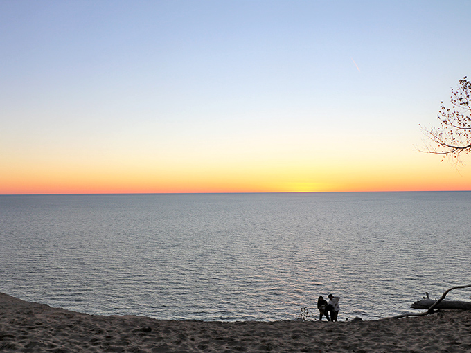 Sunset transforms Lake Michigan into liquid gold. Even smartphone cameras can't mess this up, though thousands try every evening.