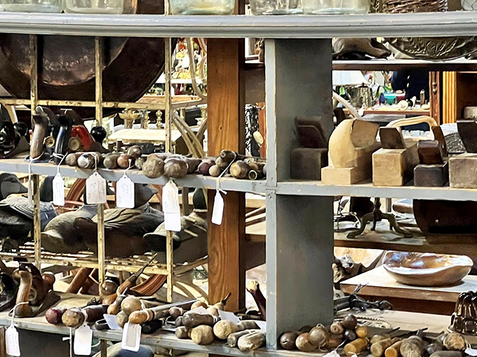 Wooden mallets and forgotten tools line these shelves, each with the patina of purpose and stories of craftsmen past.