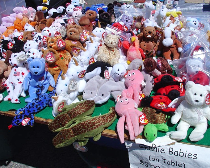 Beanie Baby reunion! These plush collectibles huddle together, tags intact, waiting for someone to rescue them from their plastic-wrapped purgatory.