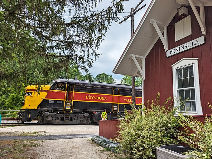 The Peninsula Depot's classic red siding provides the perfect backdrop for the railroad's signature yellow and red locomotive&mdash;a photographer's dream come true.