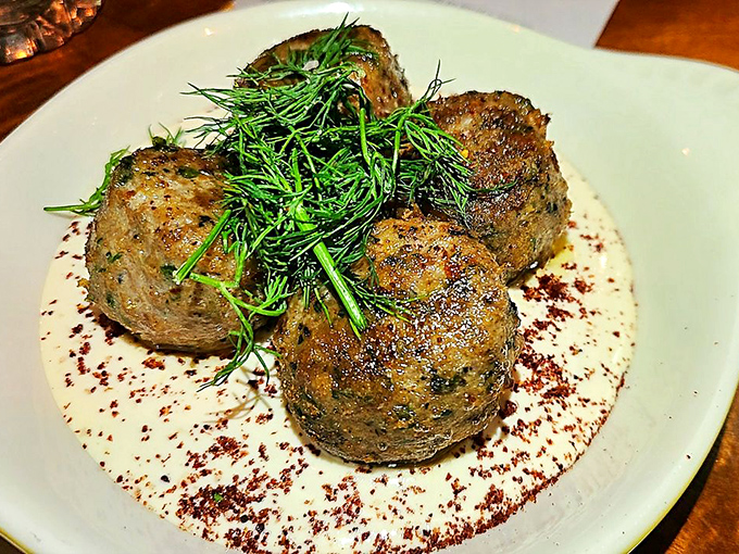 These aren't your grandmother's meatballs&mdash;unless your grandmother was a culinary genius who topped hers with fresh herbs and a silky sauce.