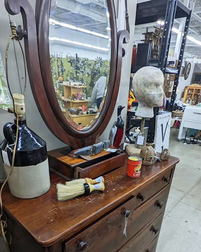 An antique vanity mirror reflects not just your face, but decades of morning routines. Someone once applied their makeup here while listening to Glenn Miller.