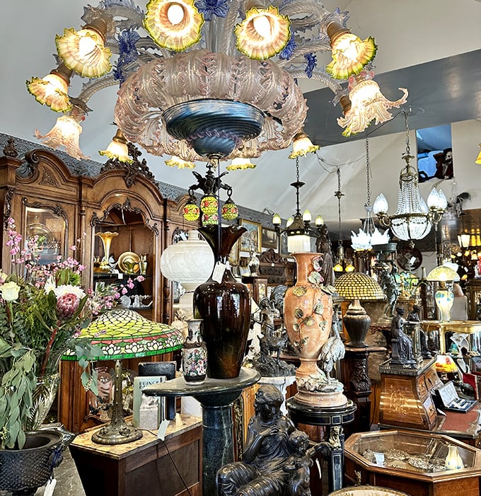 Lamplight dances through the showroom, illuminating ornate vases and figurines that have survived decades to find their place in this treasure trove.