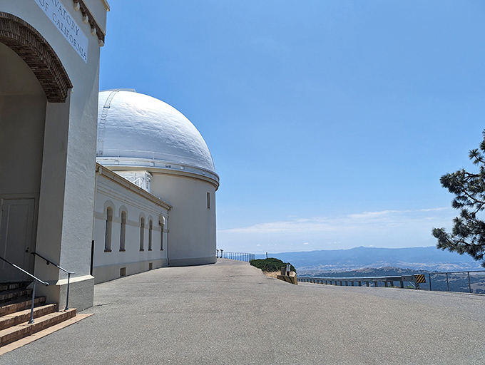 Architecture meets astronomy in perfect harmony. The gleaming white dome contrasts beautifully with the cream-colored building, all while California spreads out below like a living map.